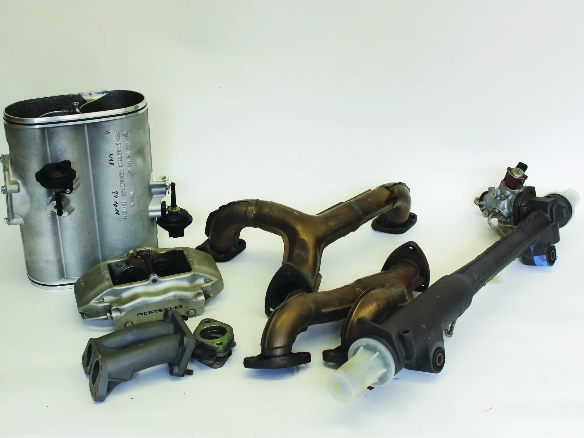 An assortment of Porsche engine, exhaust and brake parts. | Fort ...