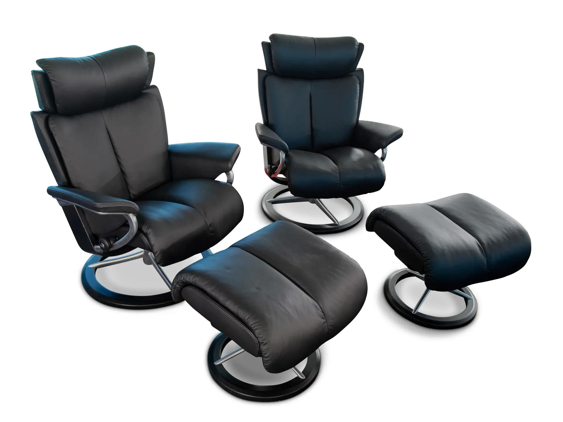 Pair of Black Stressless Chairs with Ottomans | The Elkhart Collection | RM Sotheby's