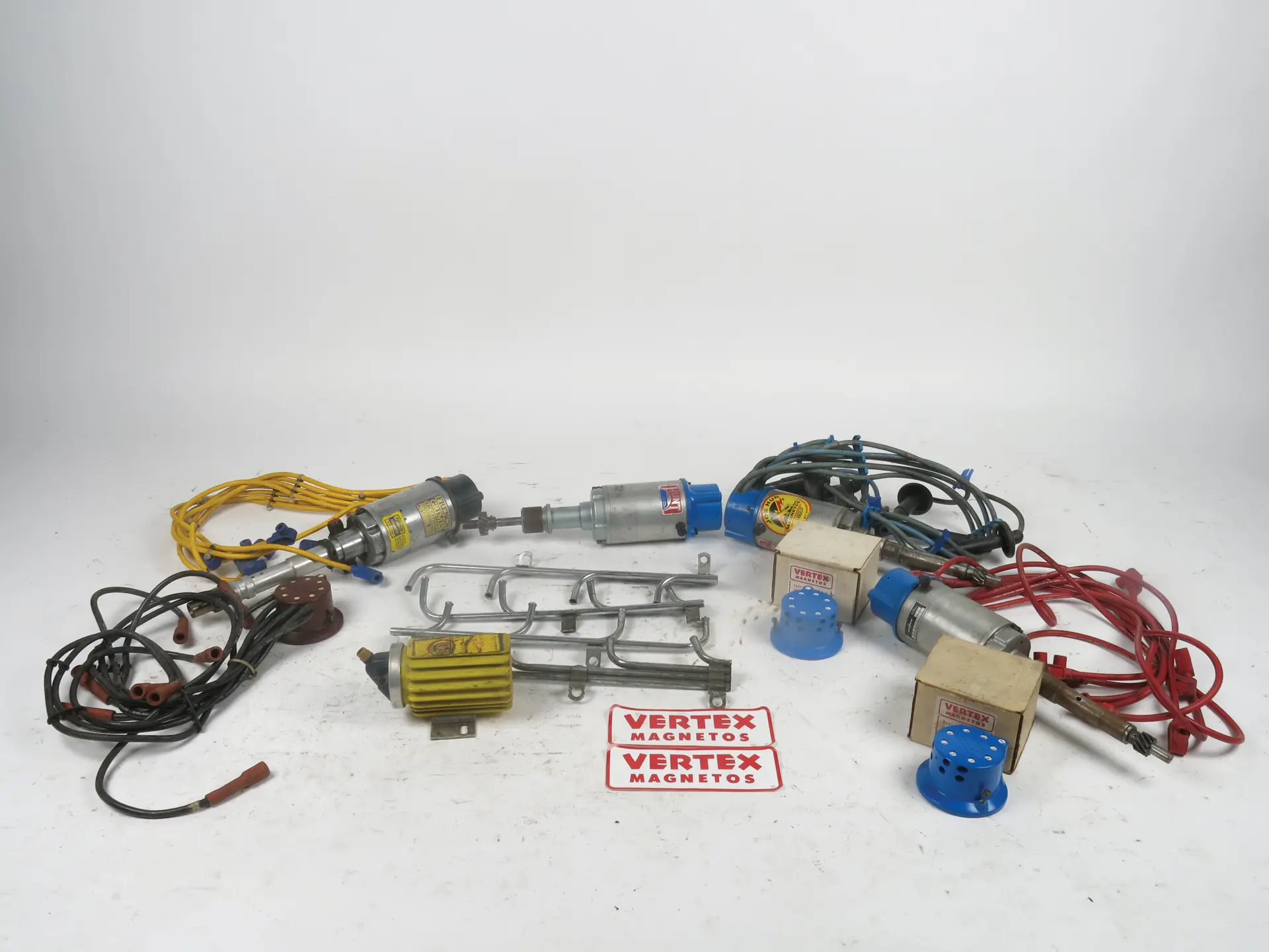 Four Vertex style magnetos (Ronco, Joe Hunt, French Grimes) plus caps ...