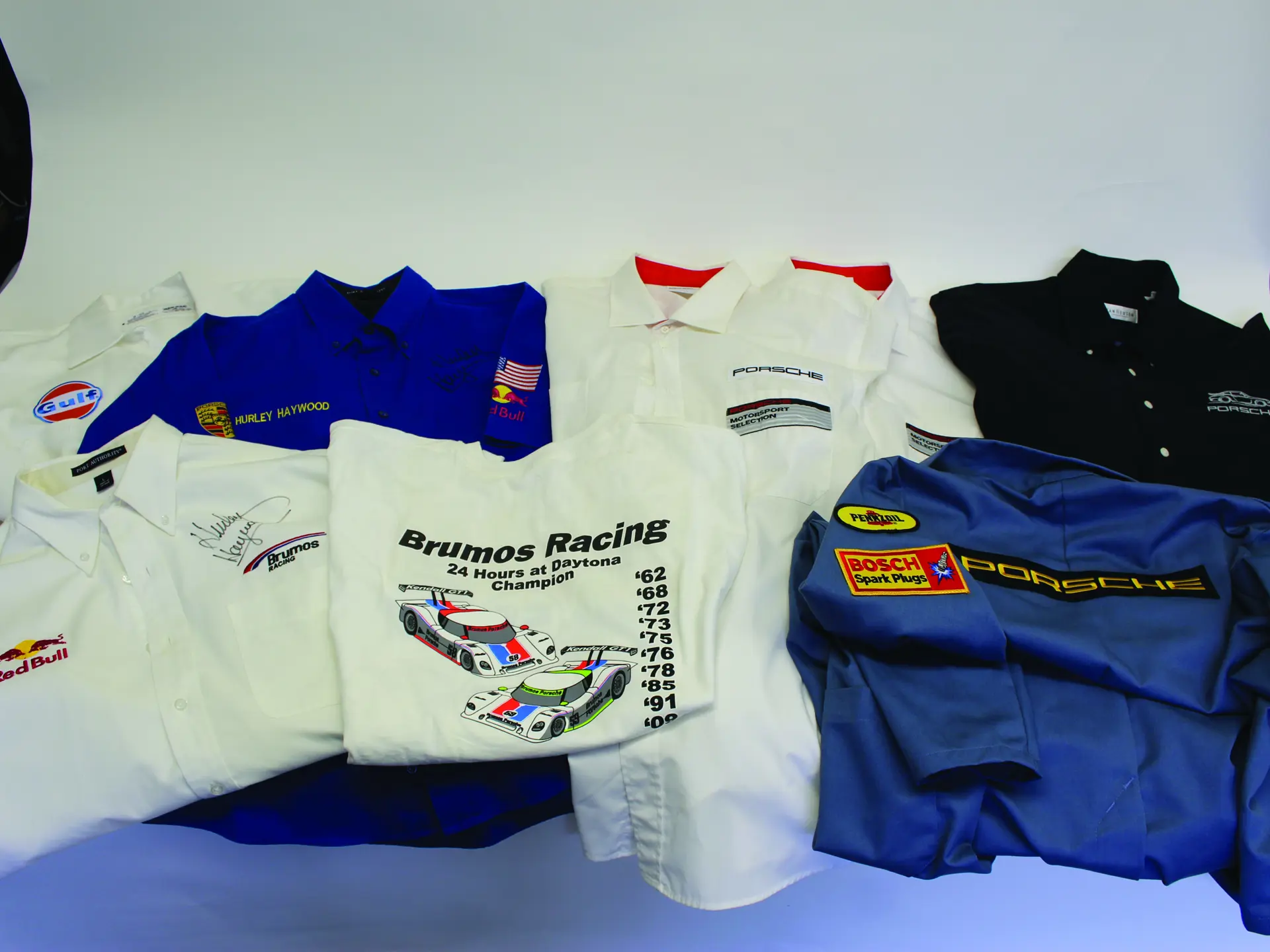 An assortment of signed, Brumos racing, Porsche performance and Porsche ...
