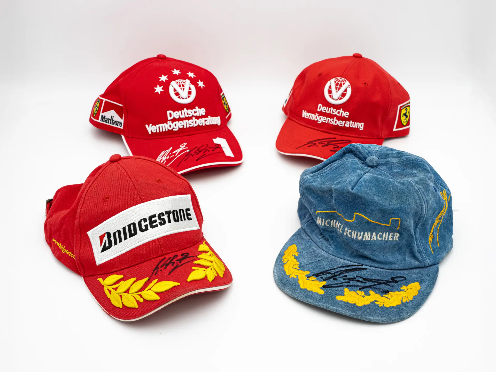 Four Assorted Michael Schumacher Formula 1 Signed Caps | The Champions ...
