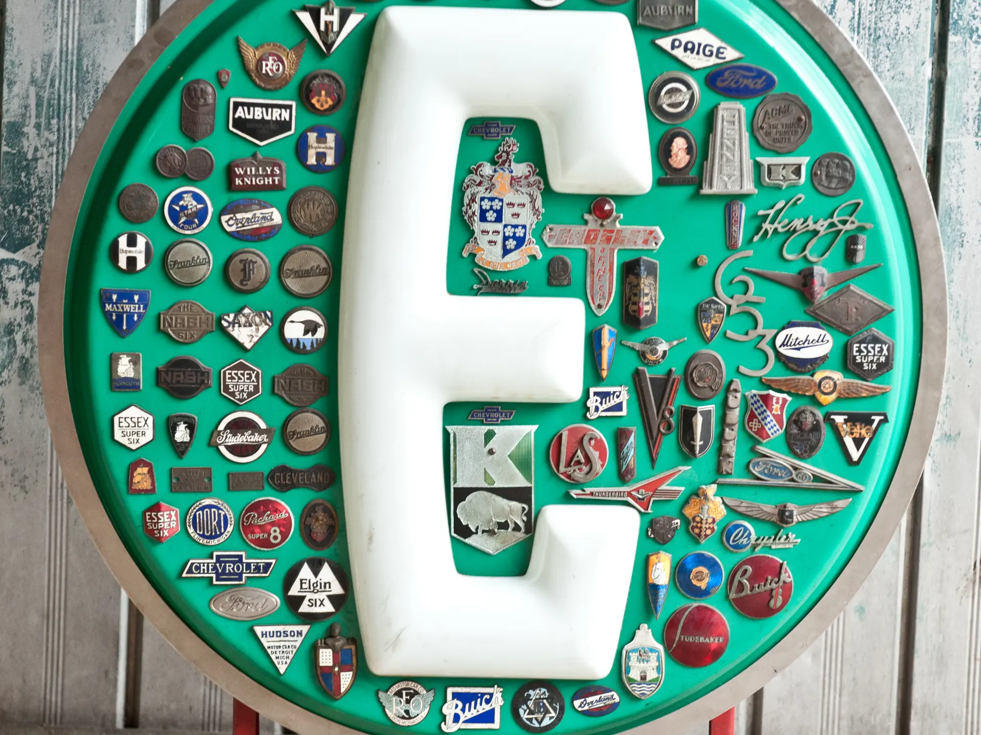 Various Makes of Radiator Emblems Mounted on Edsel Sign | The Lee Roy ...