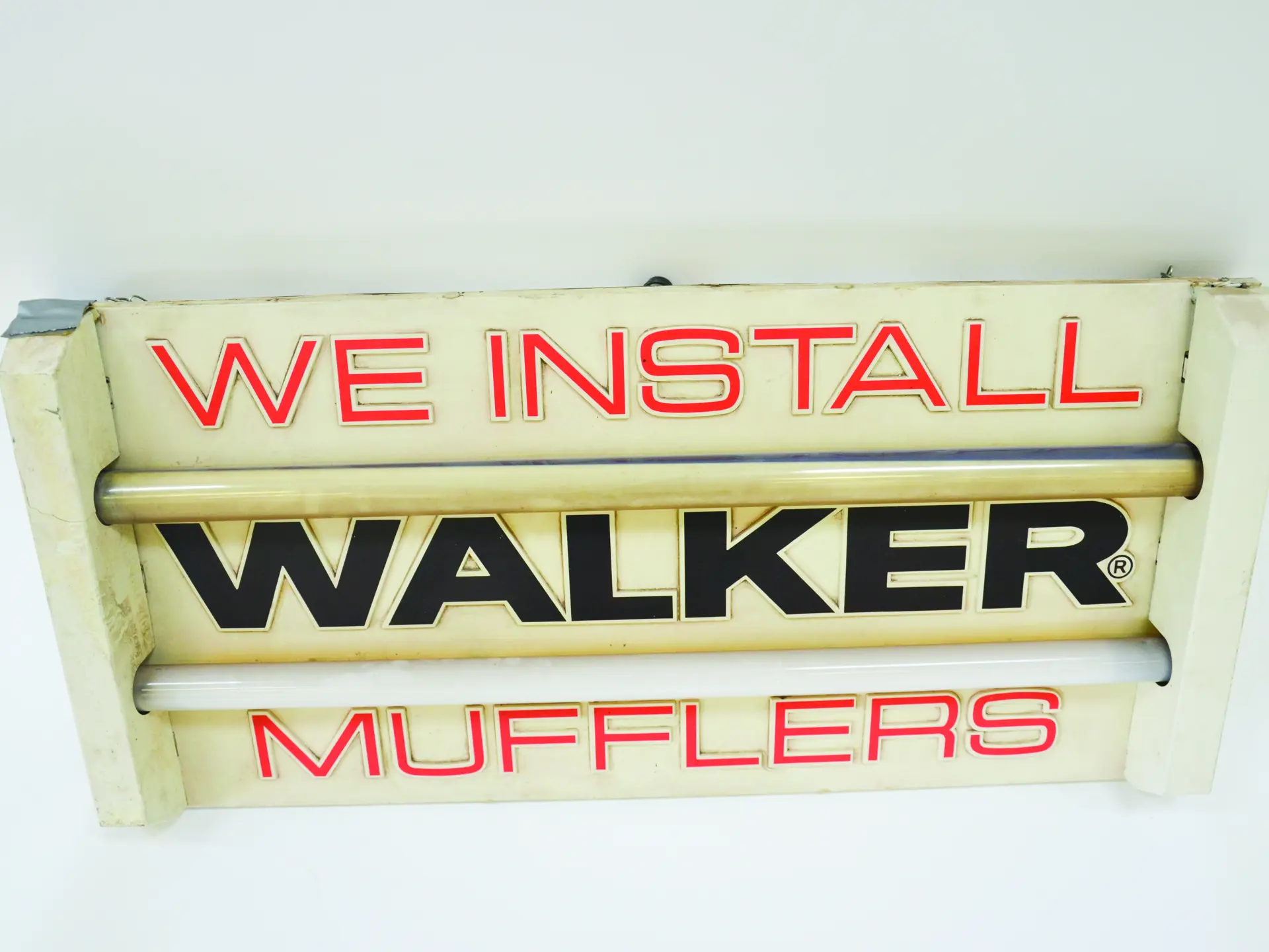 “We install Walker Mufflers” shop sign | Auburn Fall 2016 | RM Sotheby's