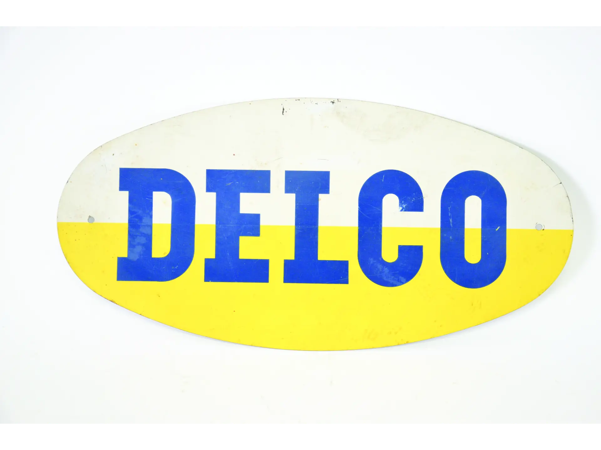 A single-sided tin Delco sign 16" x 8" | Auburn Fall 2016 | RM Sotheby's