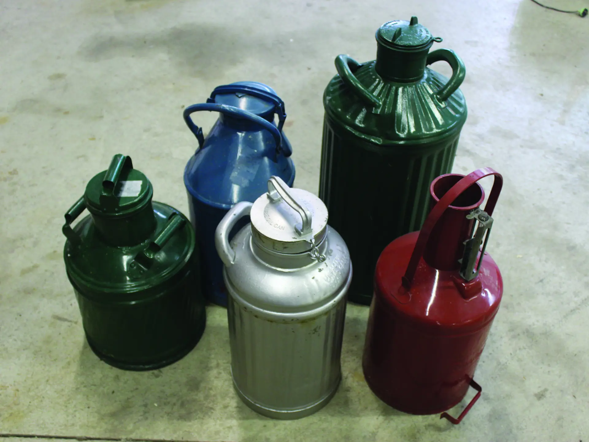 A grouping of repainted, vintage, gasoline cans | Auburn Fall 2017 | RM ...