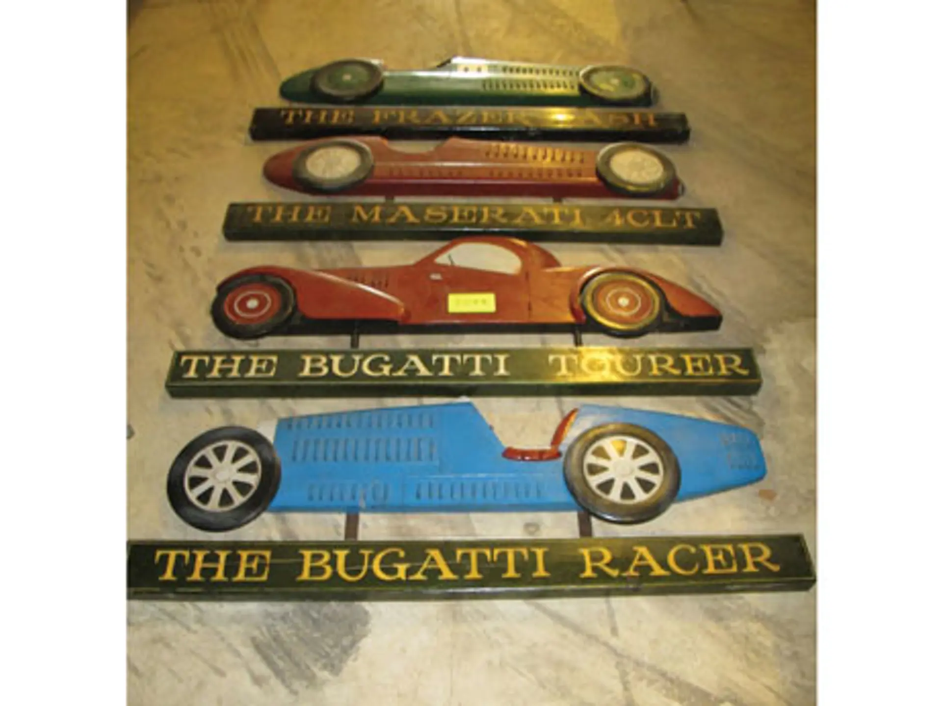 Set of Four Wooden Automotive Signs | The Bennett Collection | RM Sotheby's