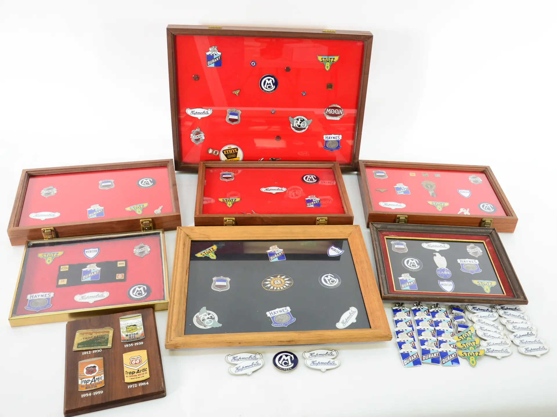 A large collection of fine reproduction automobile badges. Auto marques ...