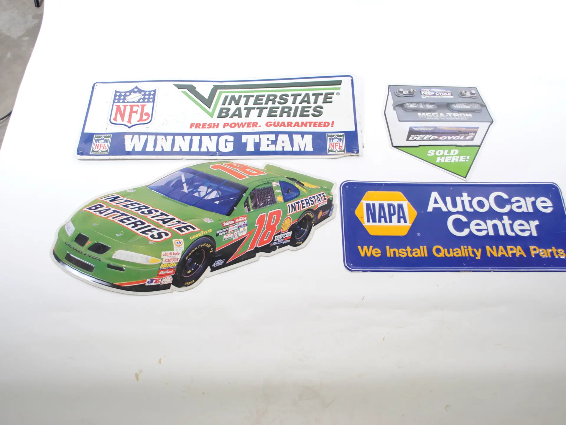 An Interstate Batteries tin sign lot | Auburn Spring 2016 | RM Sotheby's