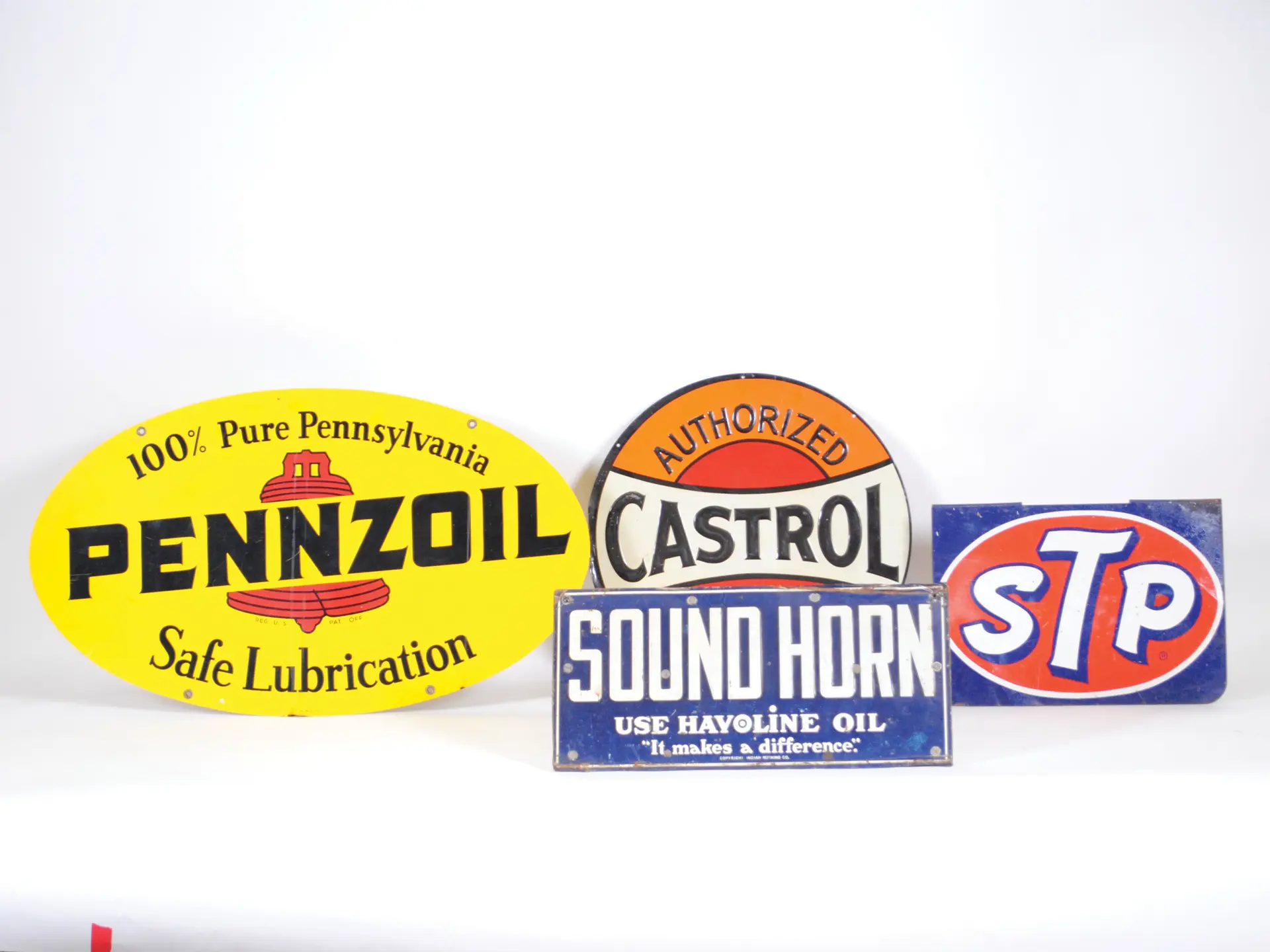 An interesting group of motor oil advertising signs | Auburn Spring ...