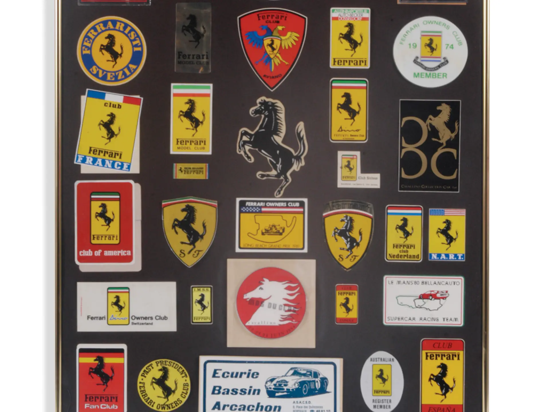 FRAMED FERRARI BADGES AND DECALS | The Ponder Collection | RM Sotheby's