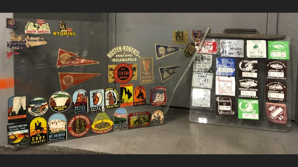 Glass with Vintage Travel Stickers | Auburn Fall 2021 | RM Sotheby's
