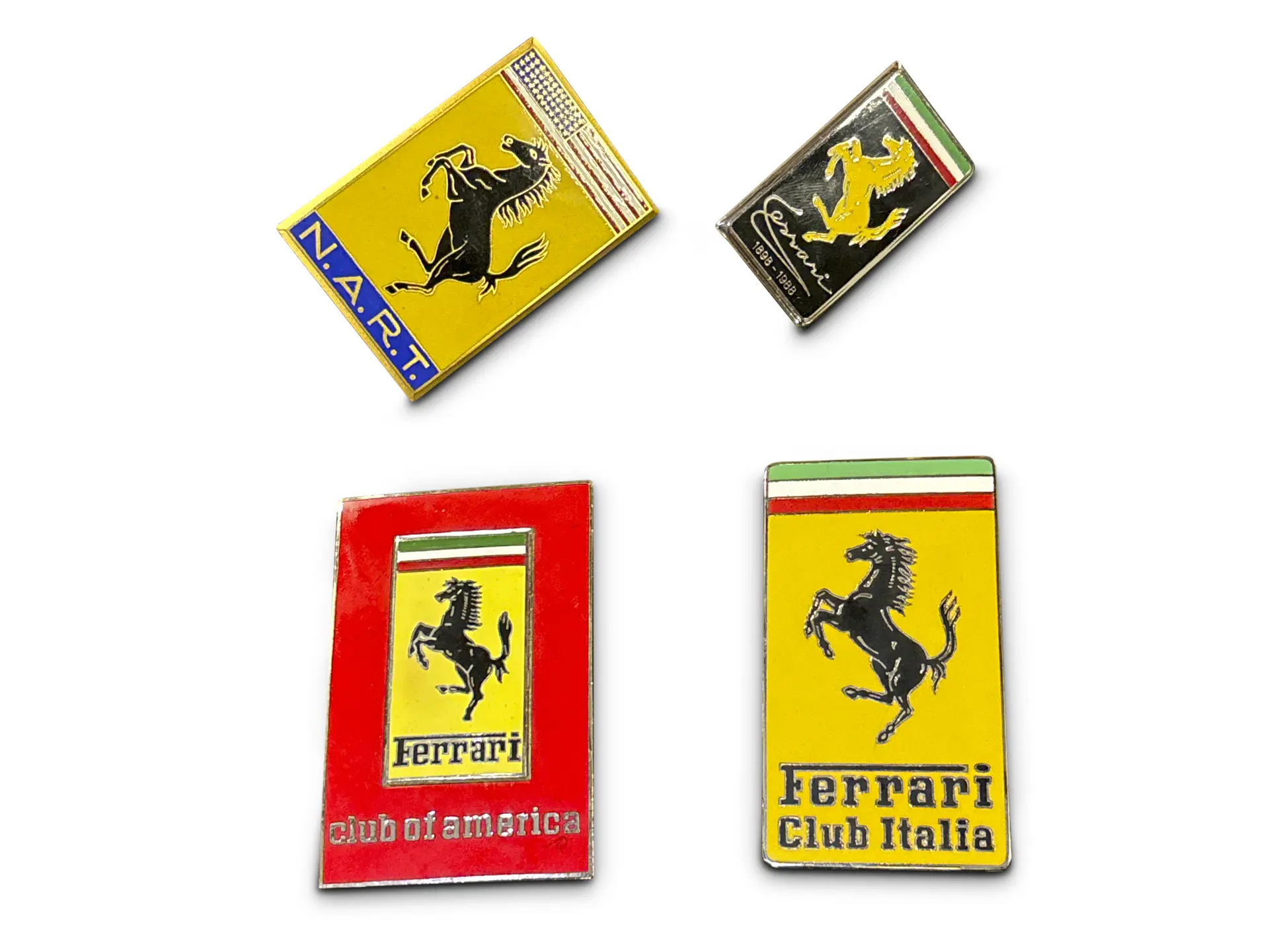 Four Ferrari Grille Badges | The Cohen Collection | RM Sotheby's