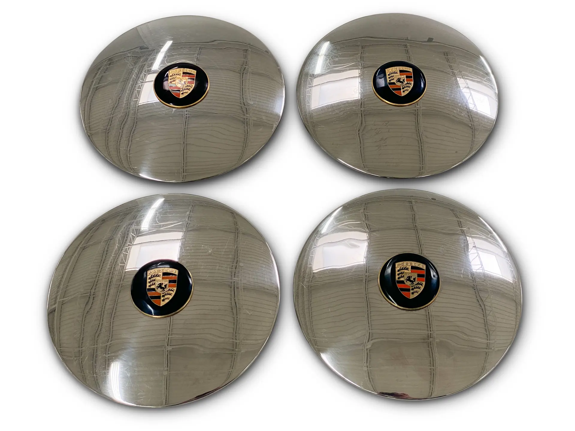 Four Porsche Hub Caps | The White Collection | Online | RM Sotheby's