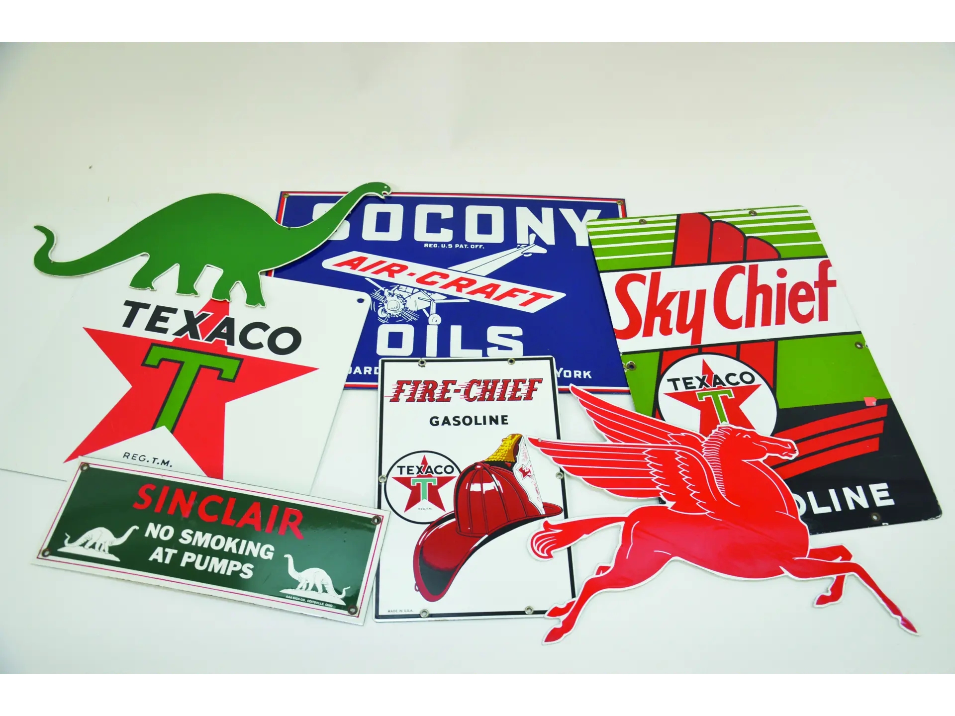 A grouping of high-quality reproduction gas and oil signs | Auburn Fall ...