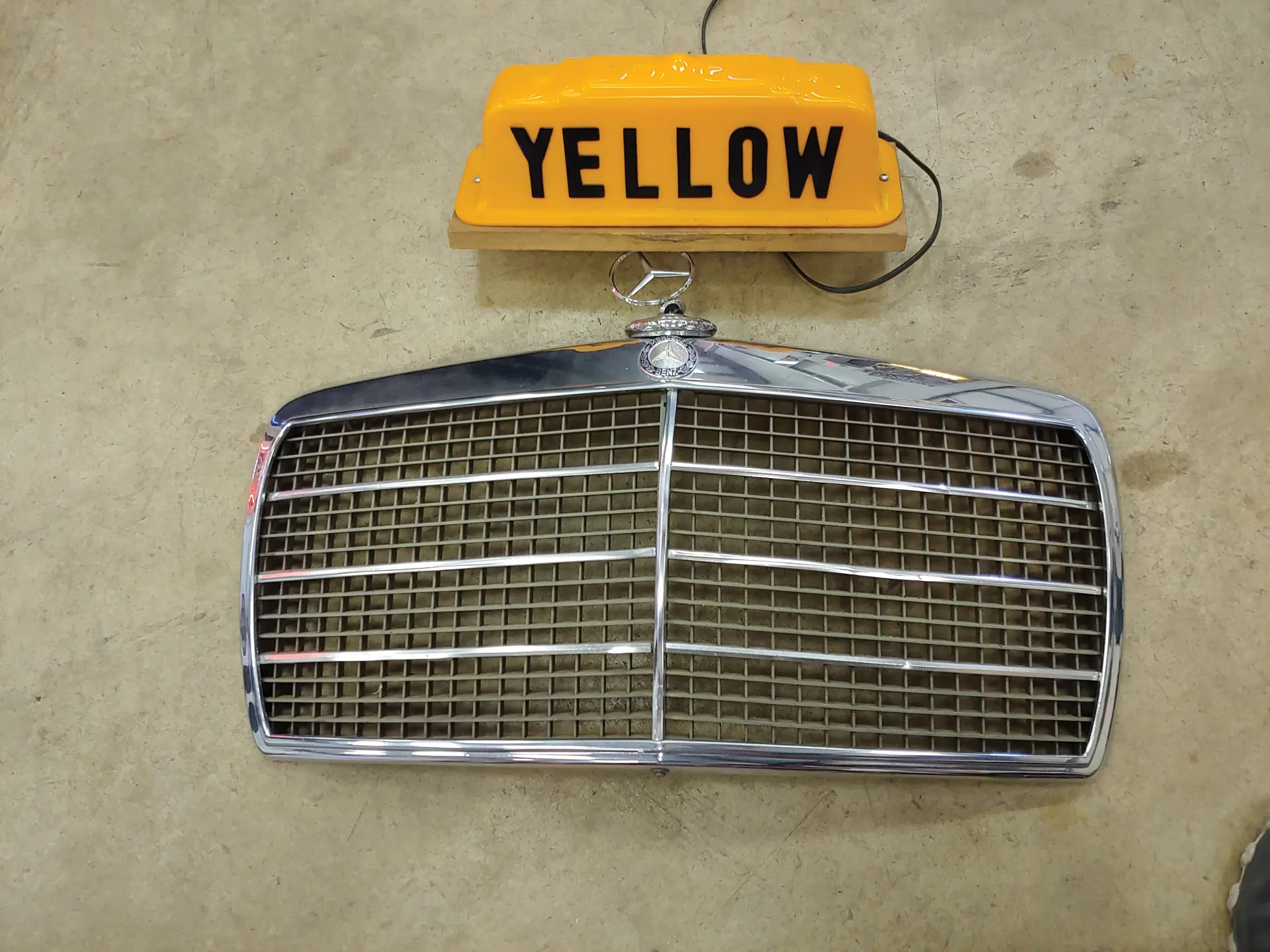 Mercedes-Benz Grille and Illuminated Yellow Taxi Plastic Roof Sign ...