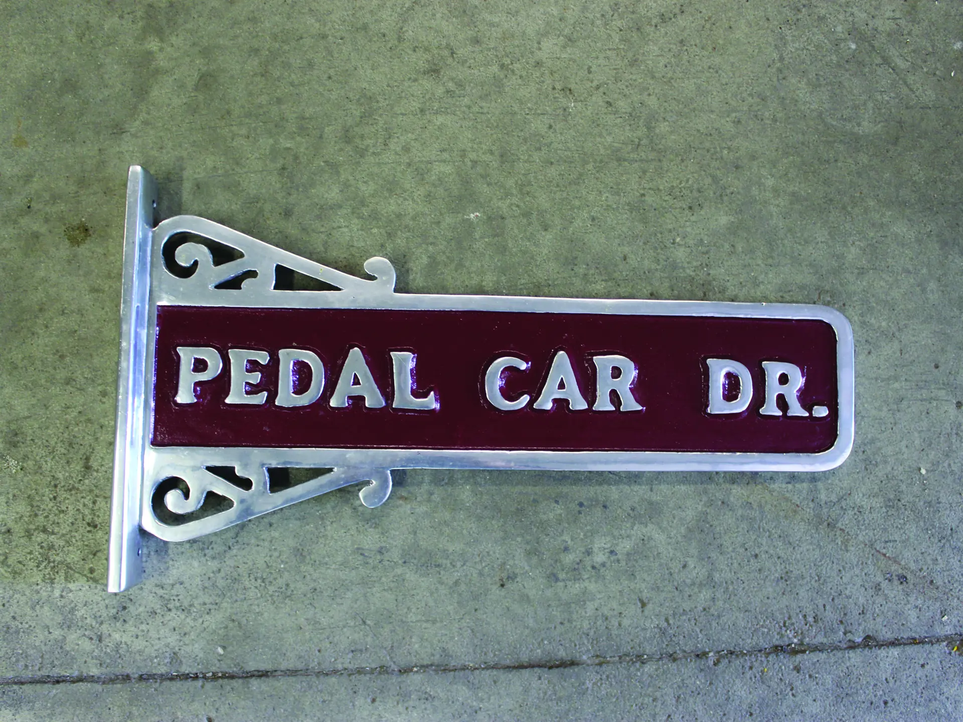 Limited edition of 12, cast aluminum 'pedal car drive,' sign | Auburn ...