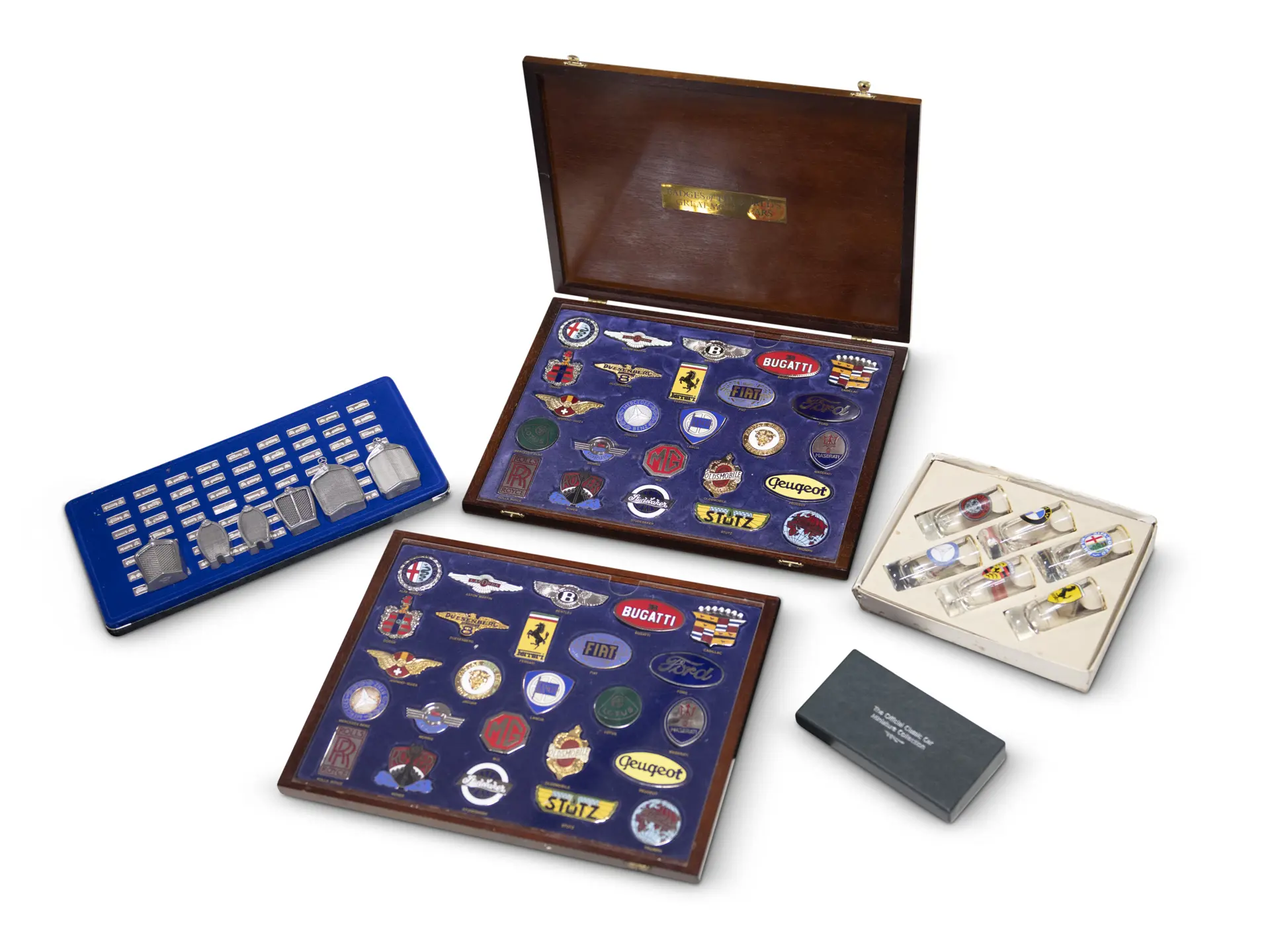 Collection of Various Marque Silver Ingots, Badges, and Radiators ...