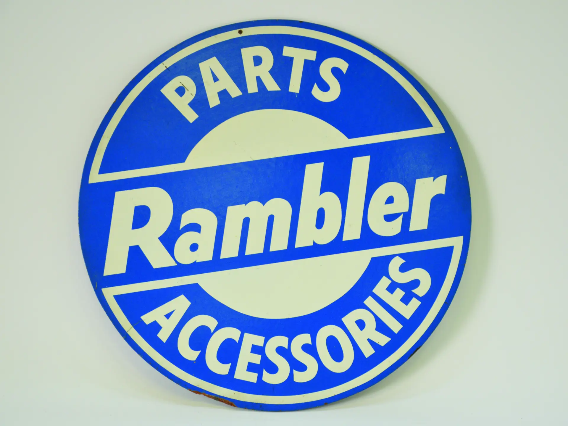 A Rambler parts and accessories fiberboard advertising sign, 18 inch ...