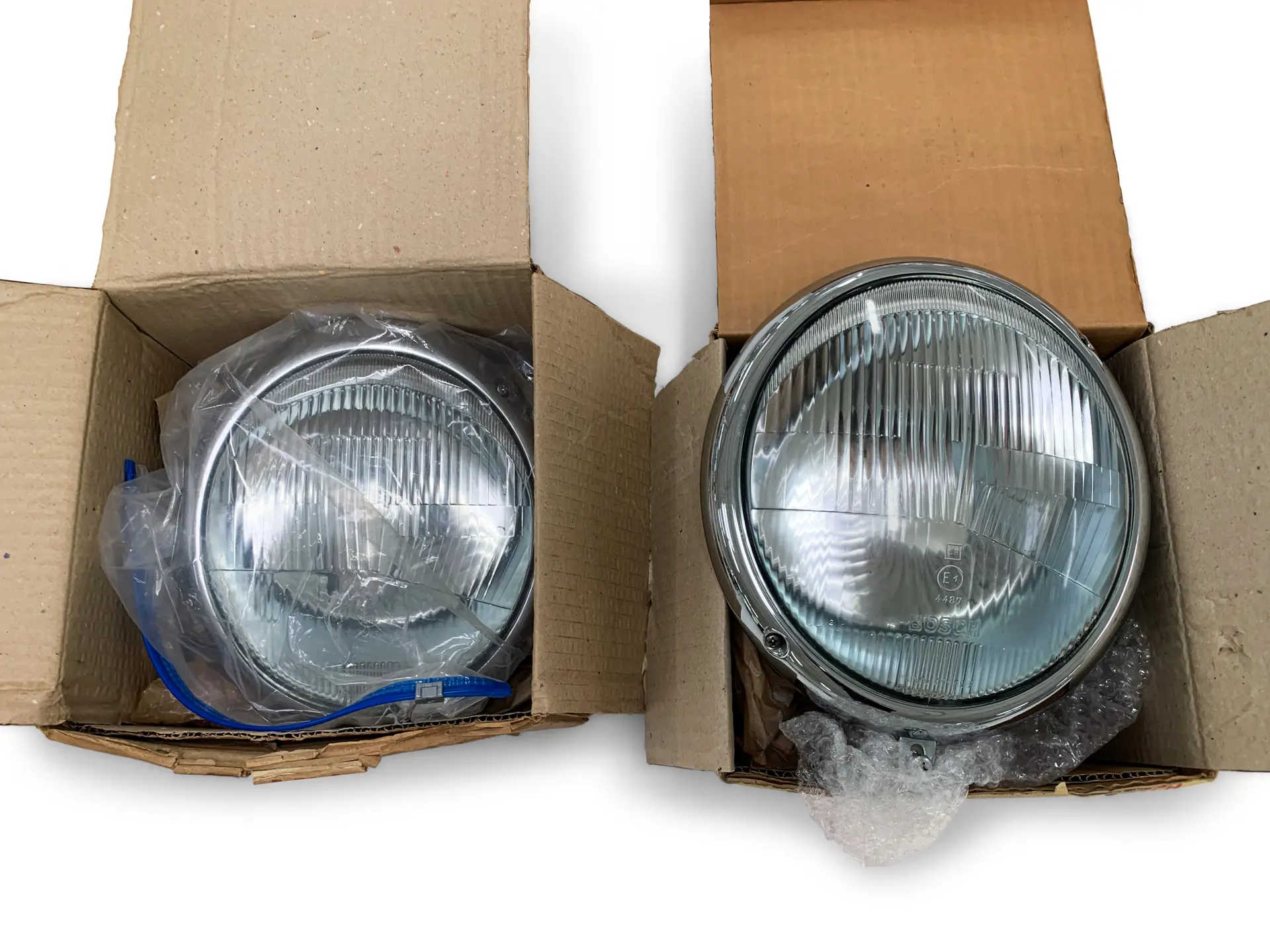 Two Bosch 4487 Headlights | The White Collection | Online | RM Sotheby's