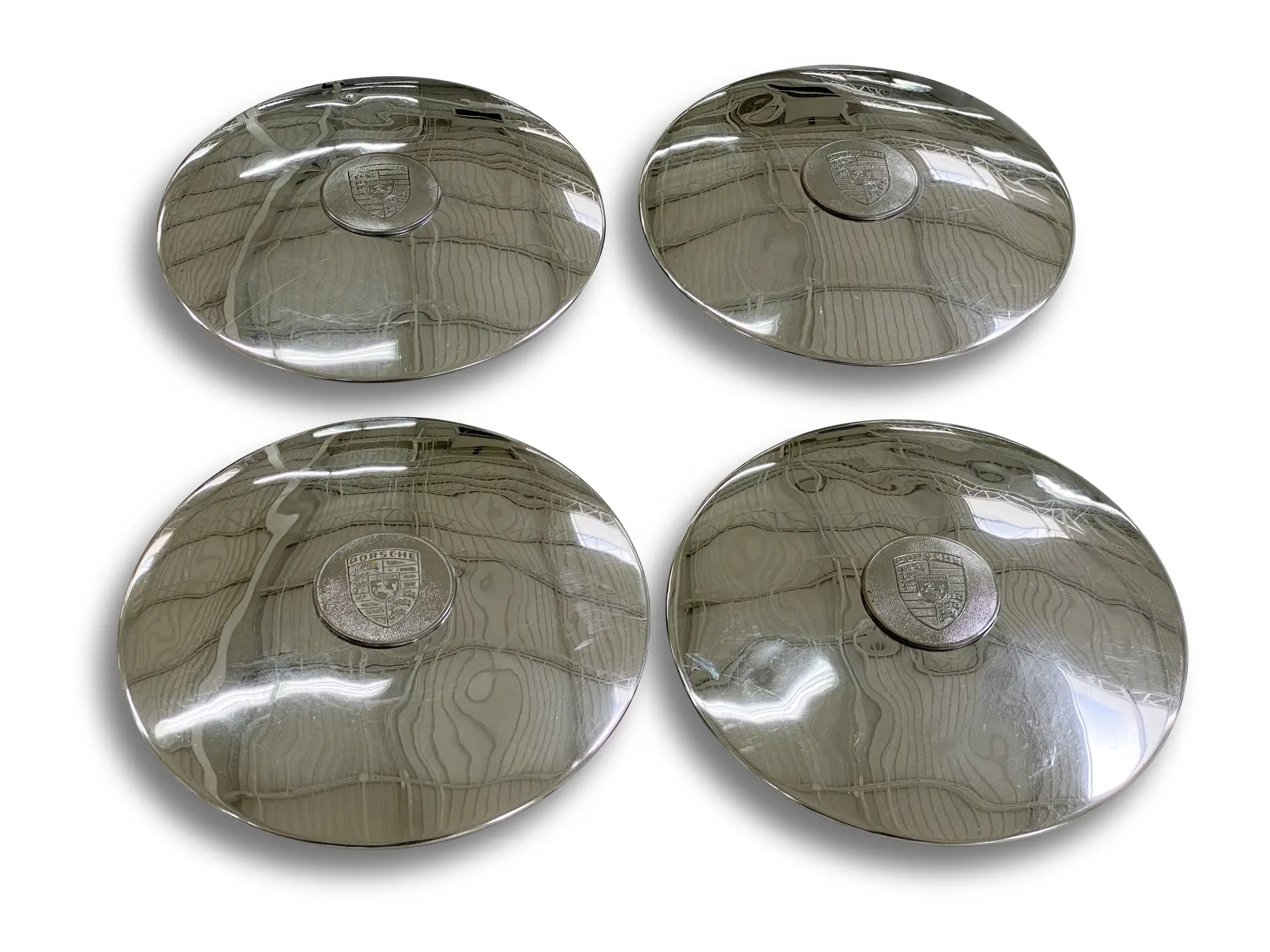 Four Porsche Hub Caps | The White Collection | Online | RM Sotheby's