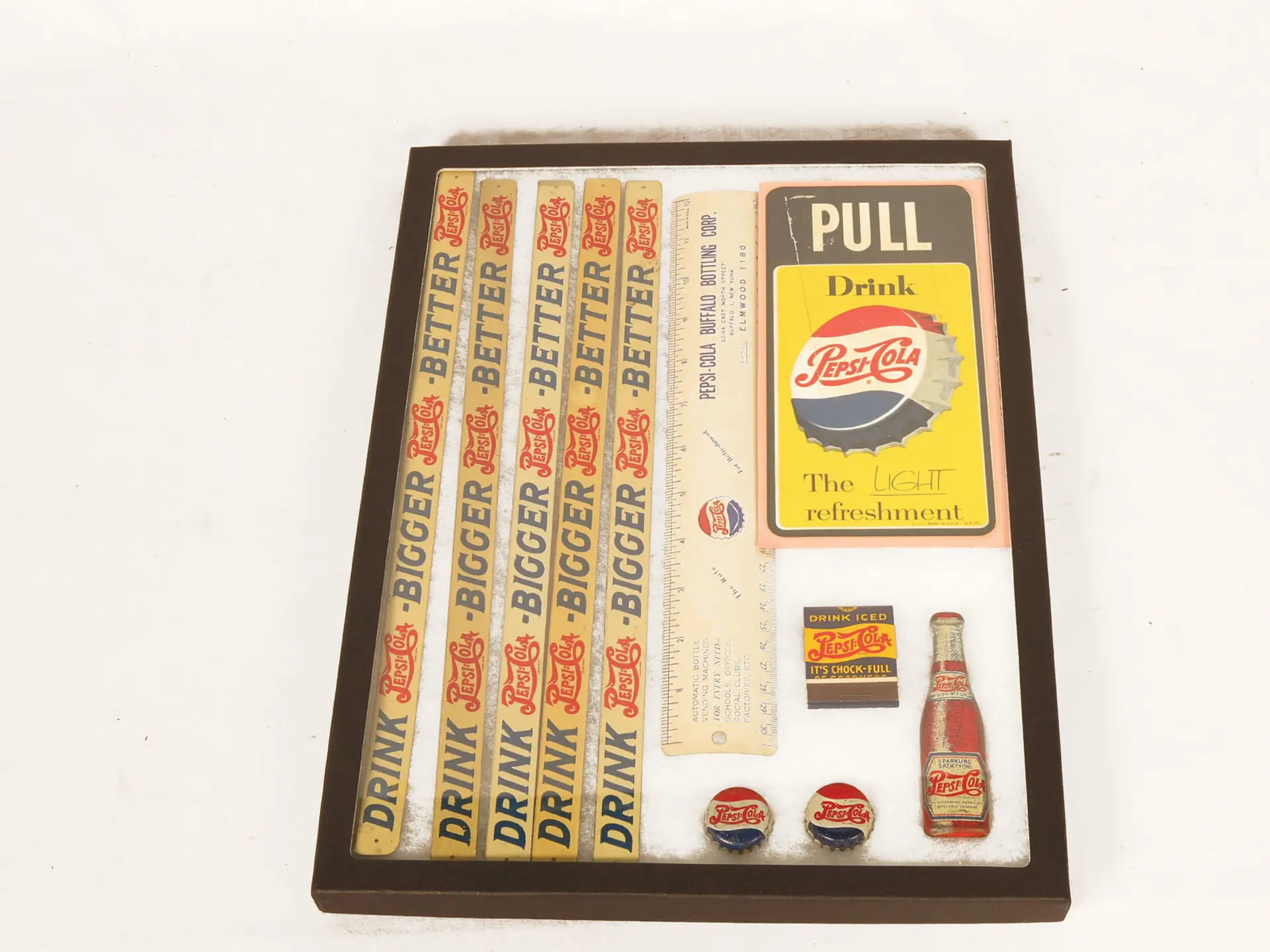 Framed Group of Pepsi-Cola Advertising Memorabilia, Tin Counter Strips ...
