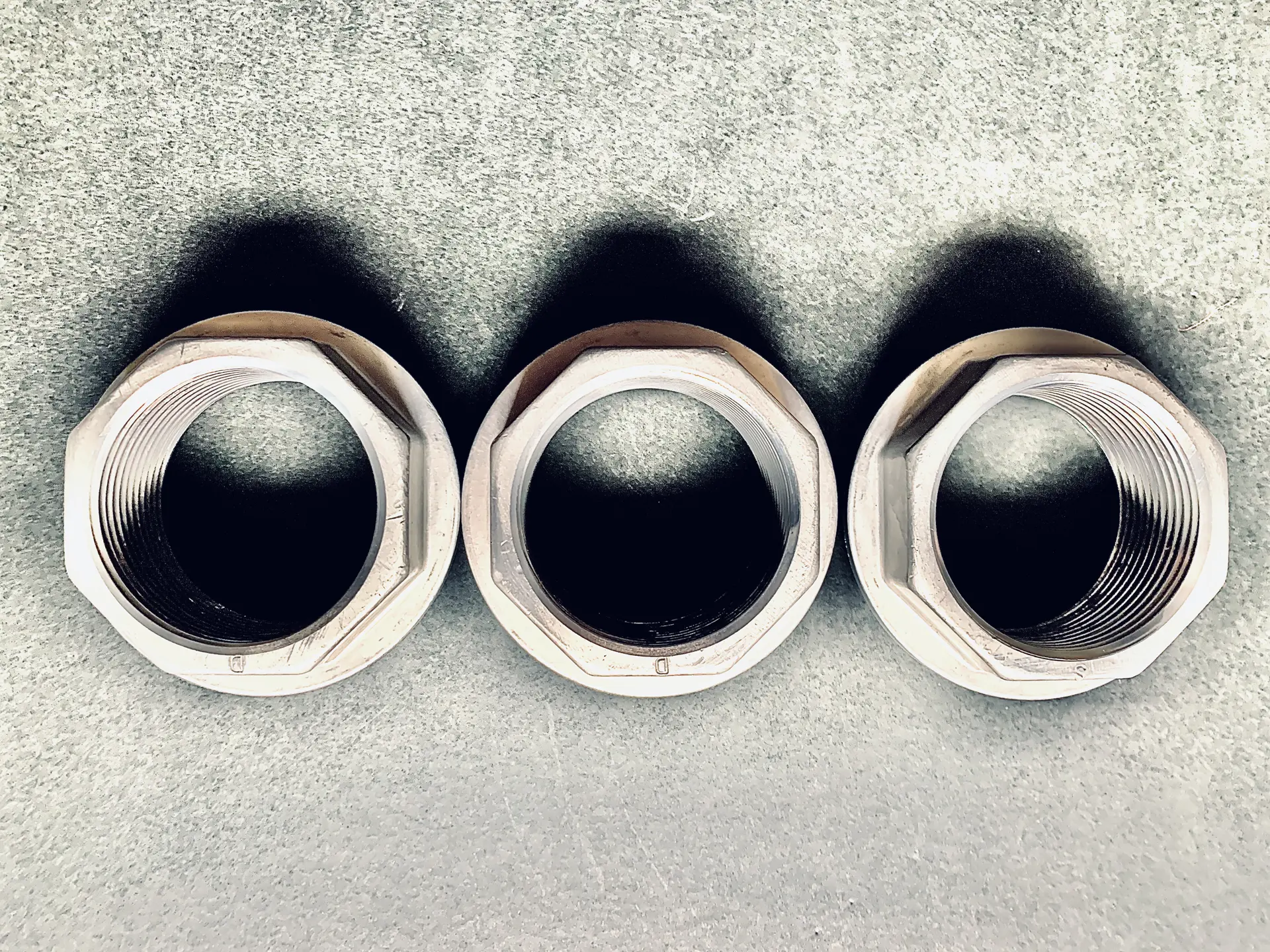 Three Ferrari F50 Centerlock Wheel Nuts | Open Roads, Fall | RM Sotheby's