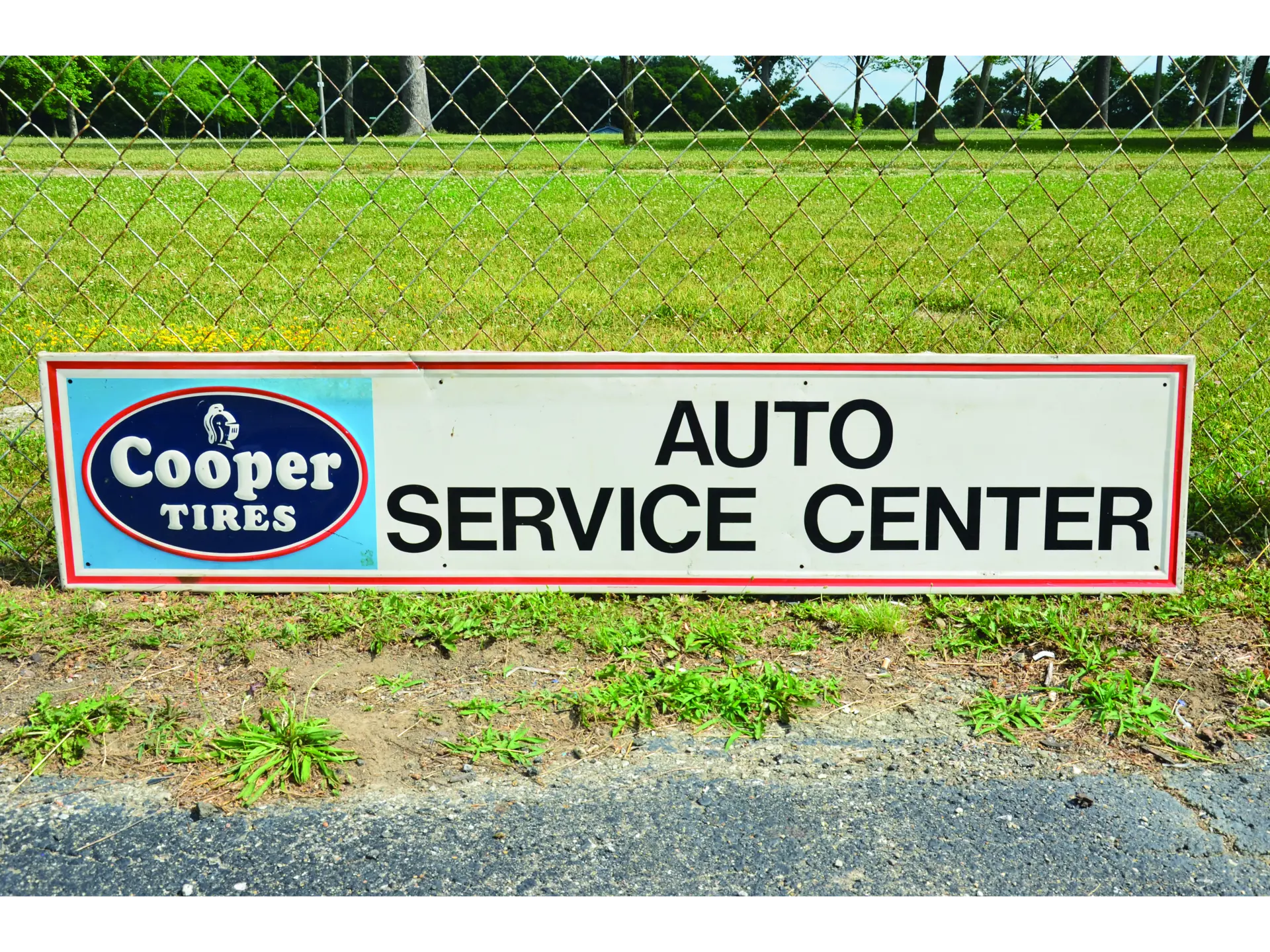 ‘Cooper Tires Auto Service Center’ sign | Auburn Fall 2016 | RM Sotheby's