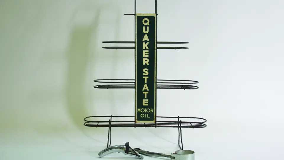 A Quaker State Motor Oil can rack. | Auburn Fall 2016 | RM Sotheby's