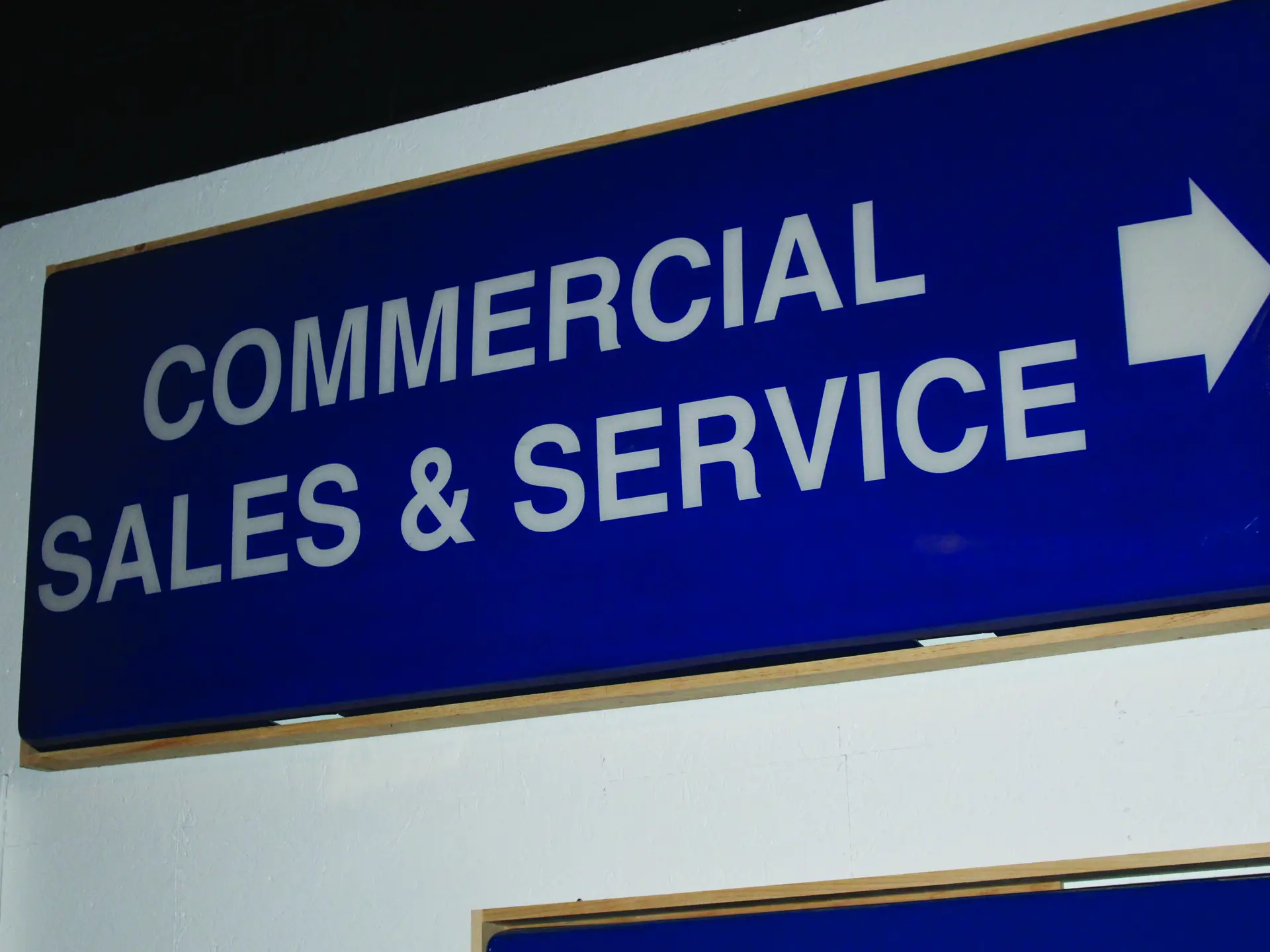 A Ford, "Service" and "Commercial Sales And Service," illumintated ...