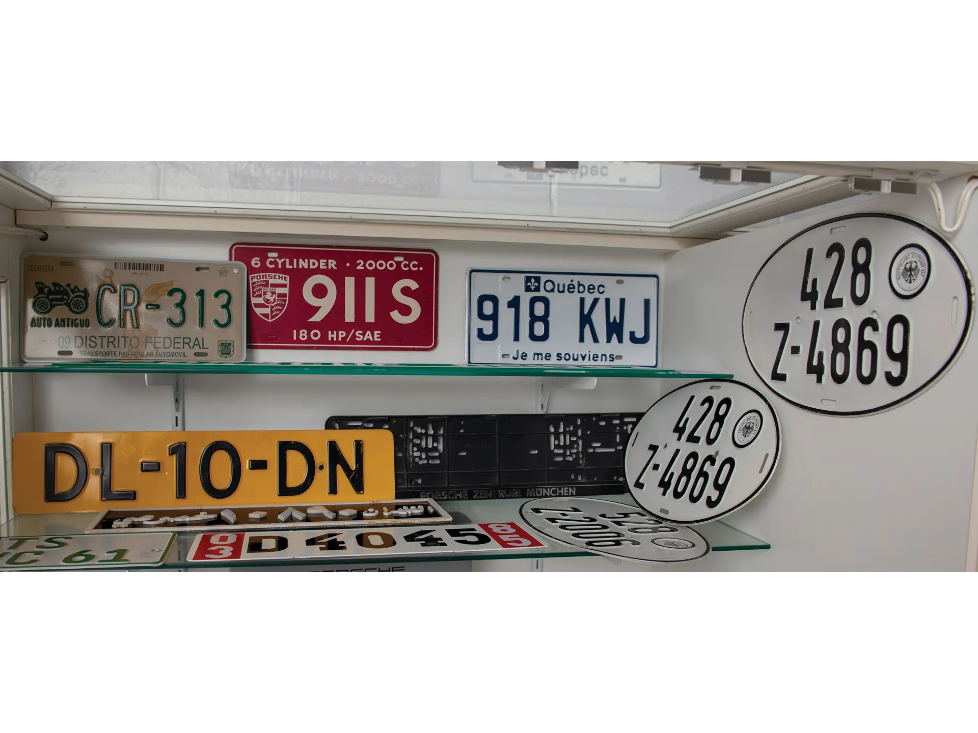 Small Collection of Foreign License Plates | The Taj Ma Garaj ...